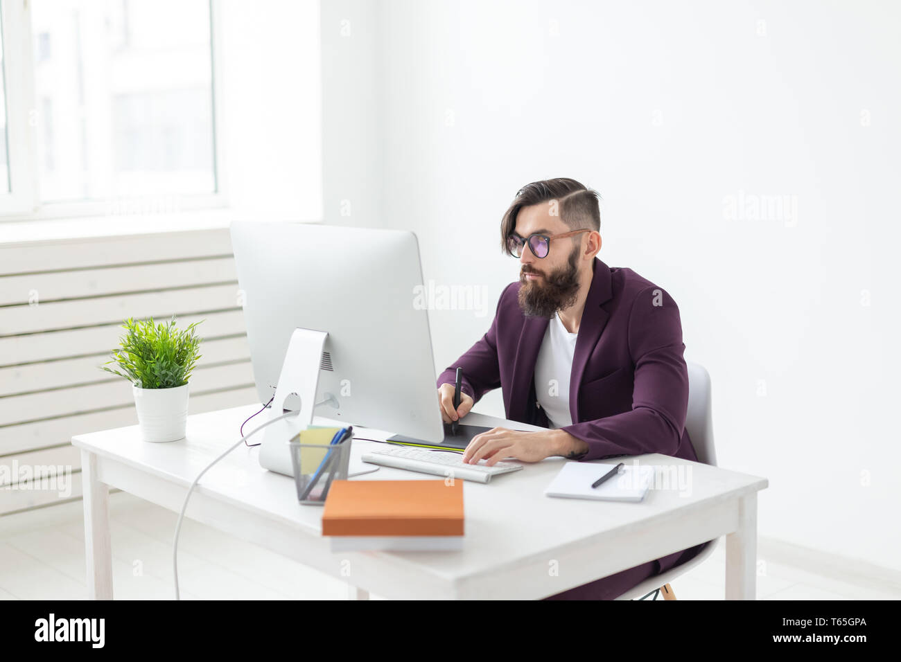 people, design and style concept - graphic designer sketching new ...