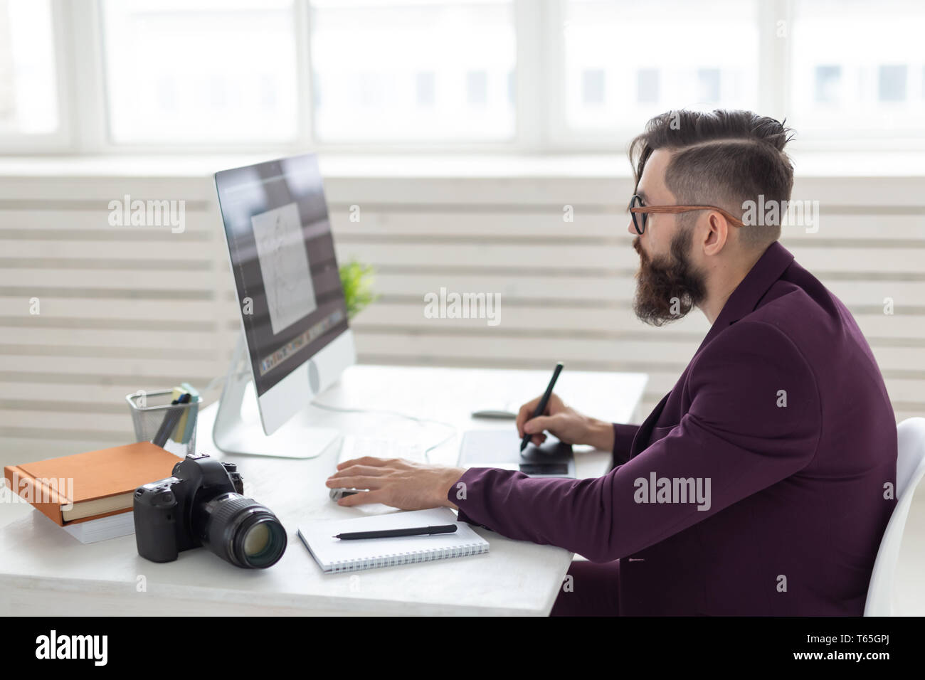 people, design and style concept - graphic designer sketching new ...