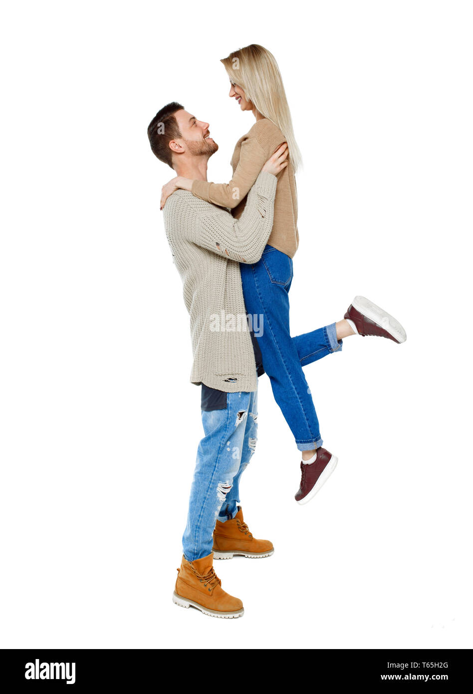 Side view of a stylish couple. beautiful friendly girl and guy together ...