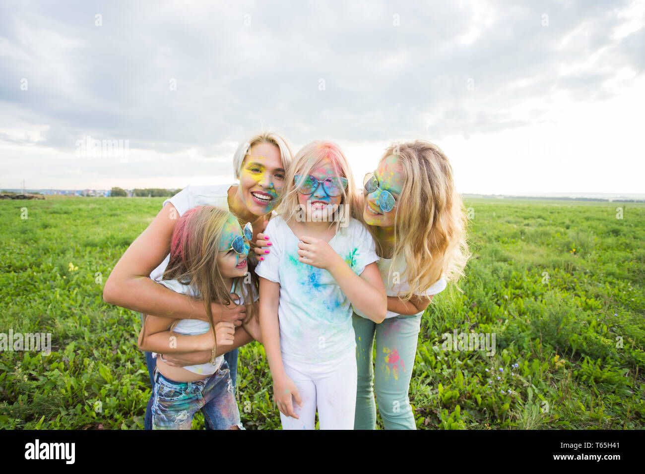 Friendship, holidays, color concept - friends smiling and having fun in ...