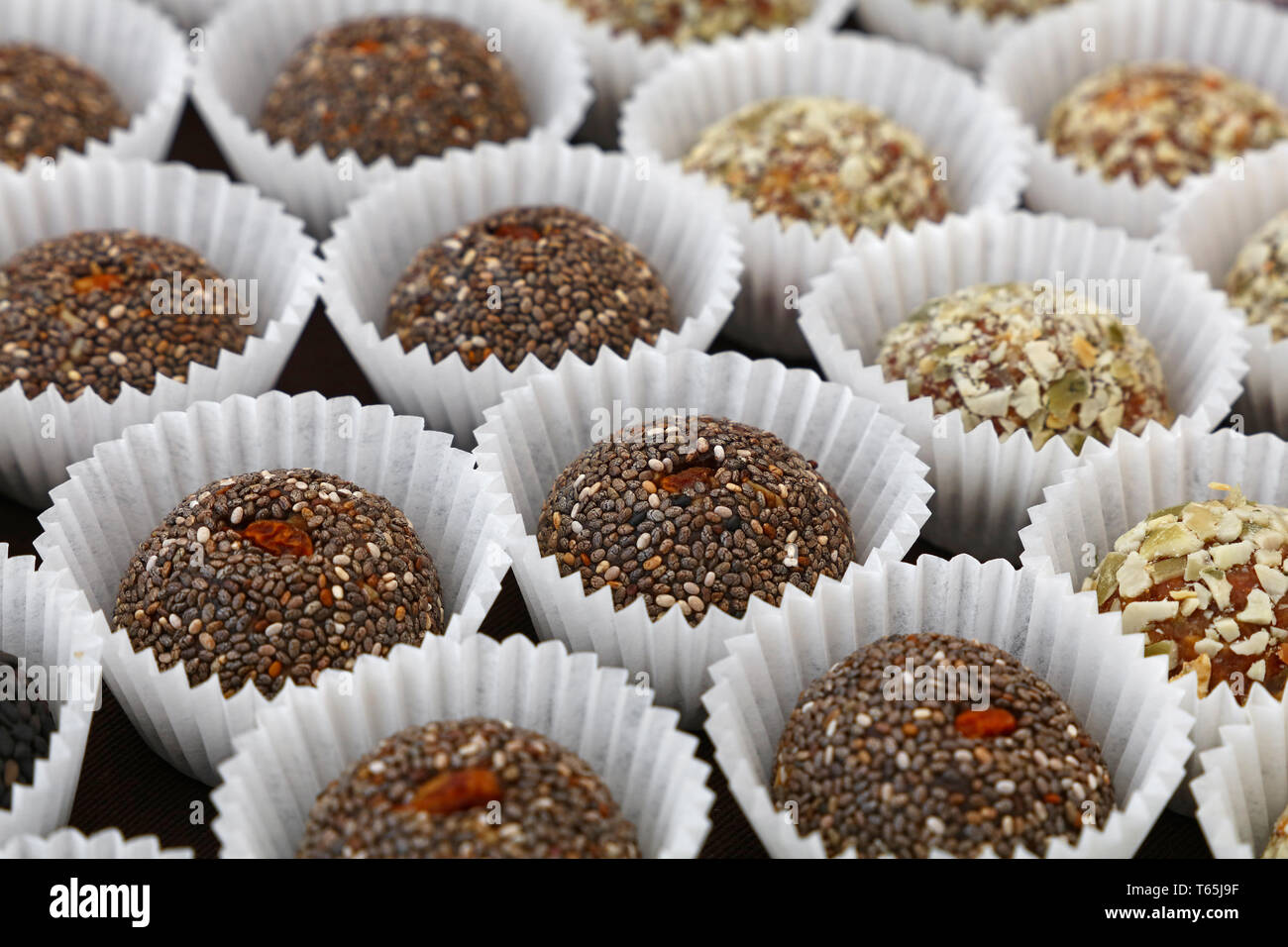 Close up assorted multicolor sweet candy cookies in retail display of ...