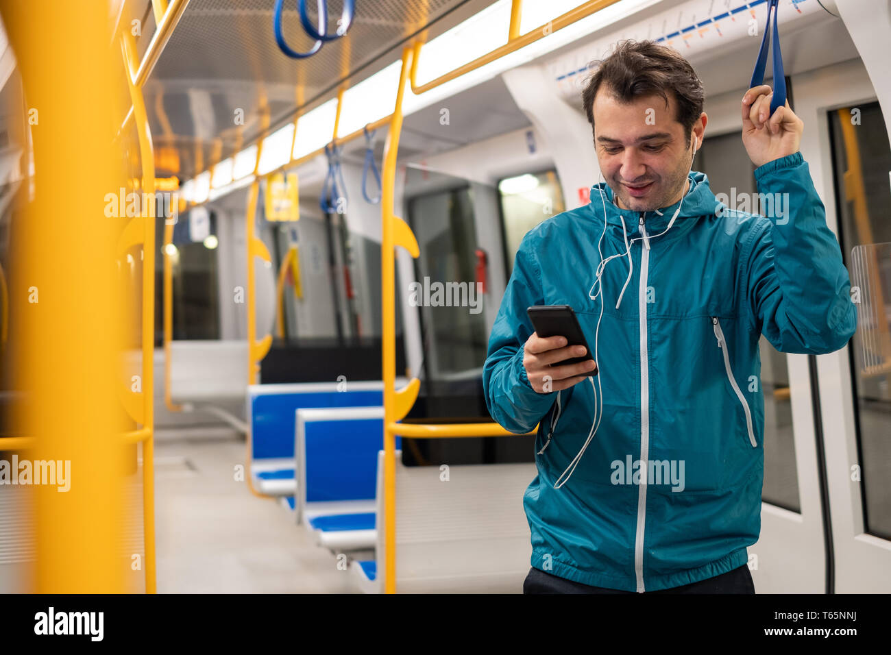 Reading smartphone public transport hi-res stock photography and images ...