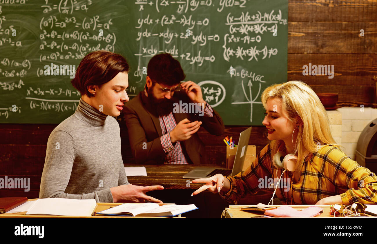 Teacher conveys sense of leadership to students. Teenage female student ...