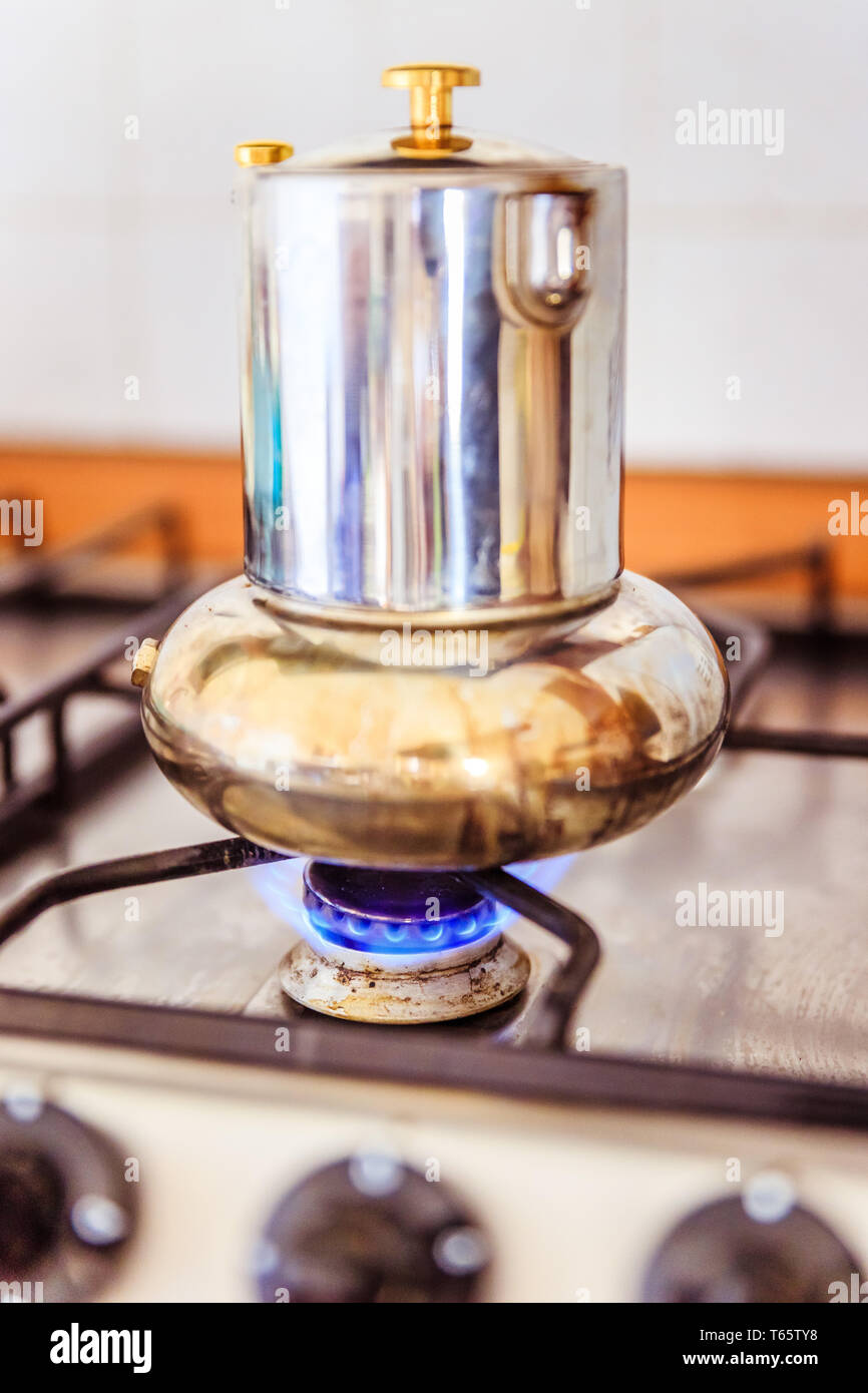 Italian coffee cooker on gas stove, breakfast Stock Photo - Alamy