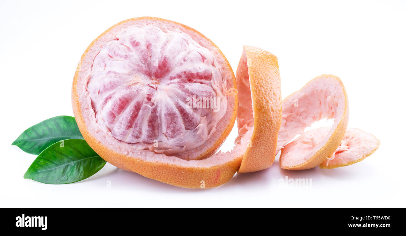 Half-peeled grapefruit with green leaves isolated on white background ...