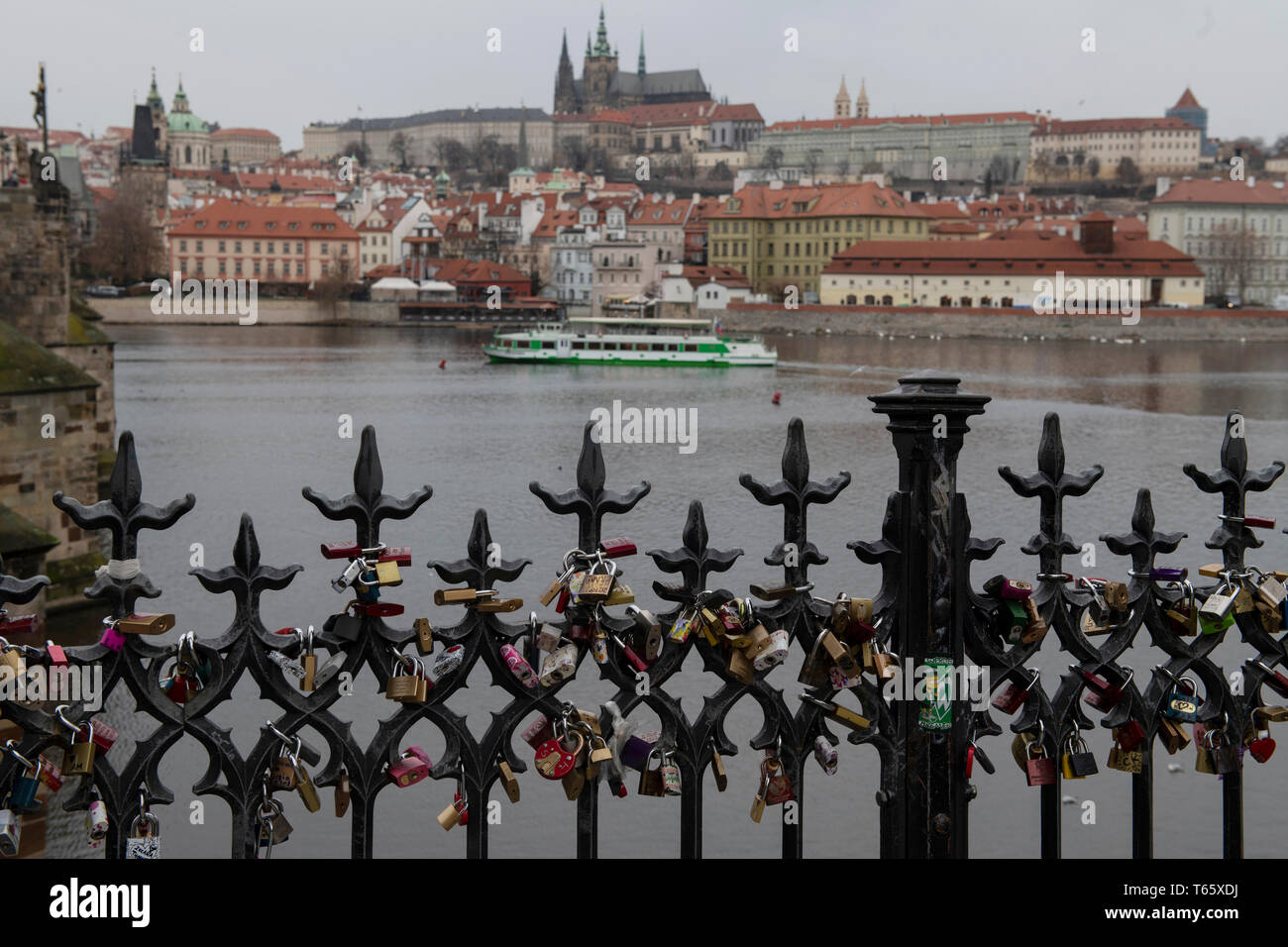 Love locks on gate, with St Vitus Cathedral and Prague Castle in ...