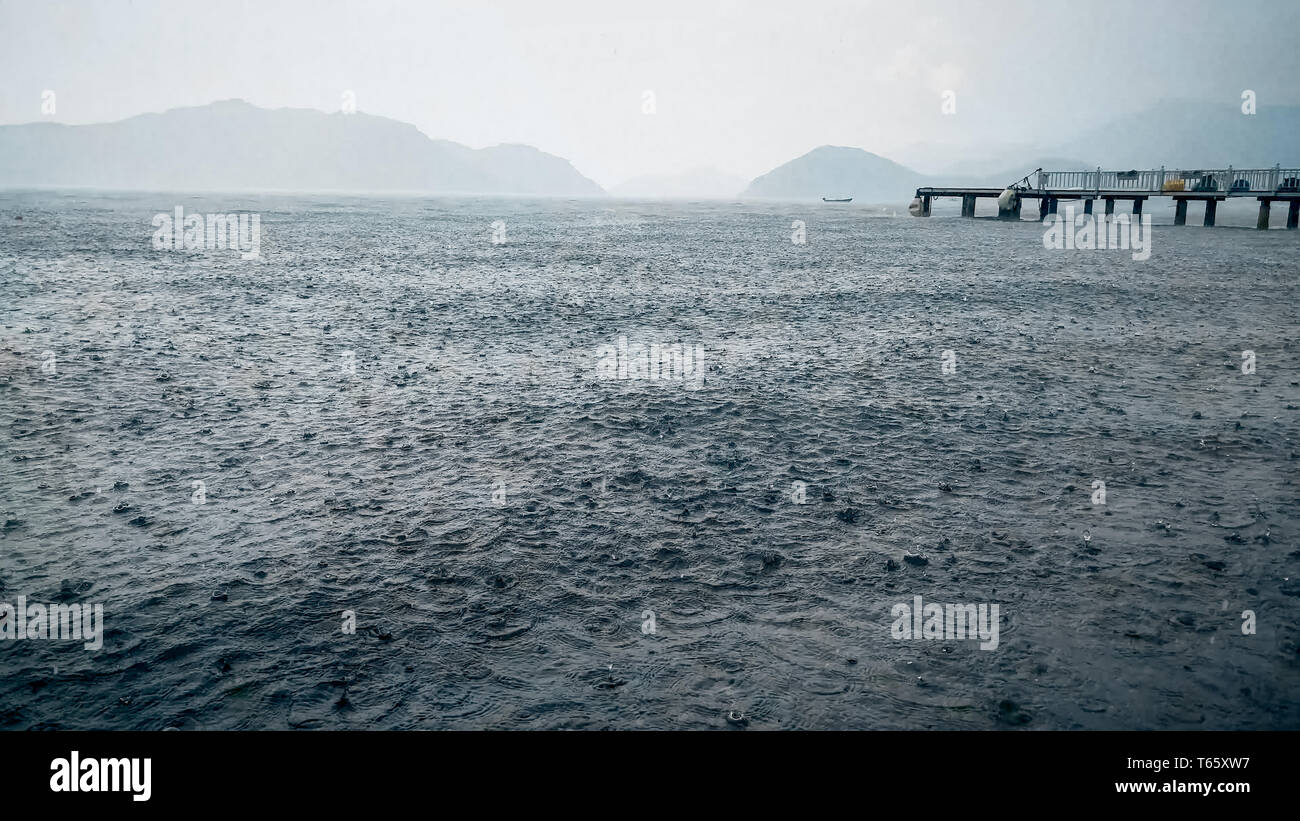 Rain cloud over beach chair hi-res stock photography and images - Alamy