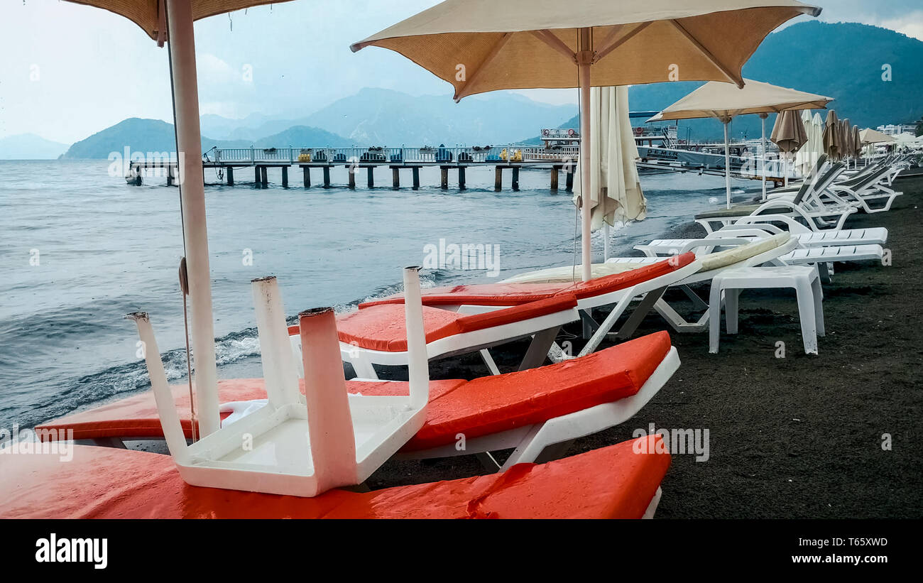Image of raining on the sea beach. Storm during summer holiday. Spoiled ...