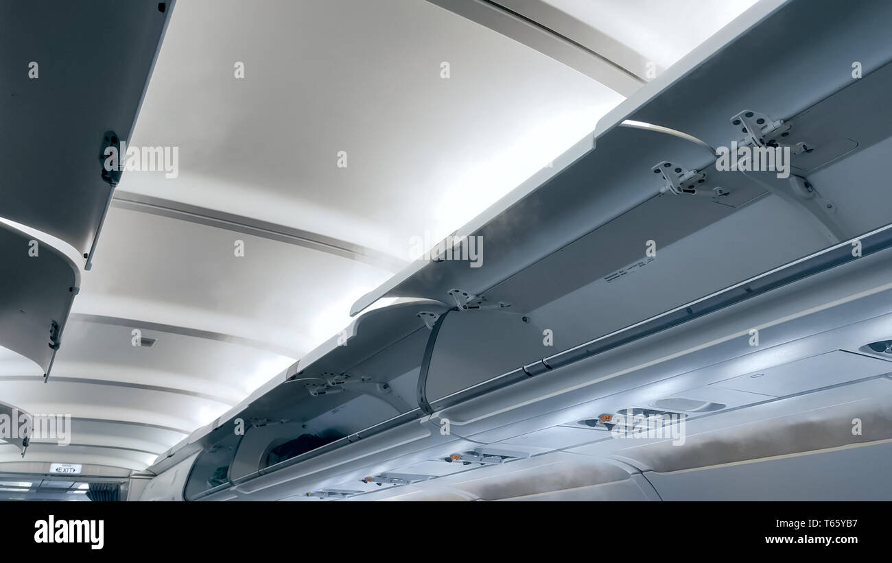 Open storage arae for bags under the ceiling at passsenger airplane ...