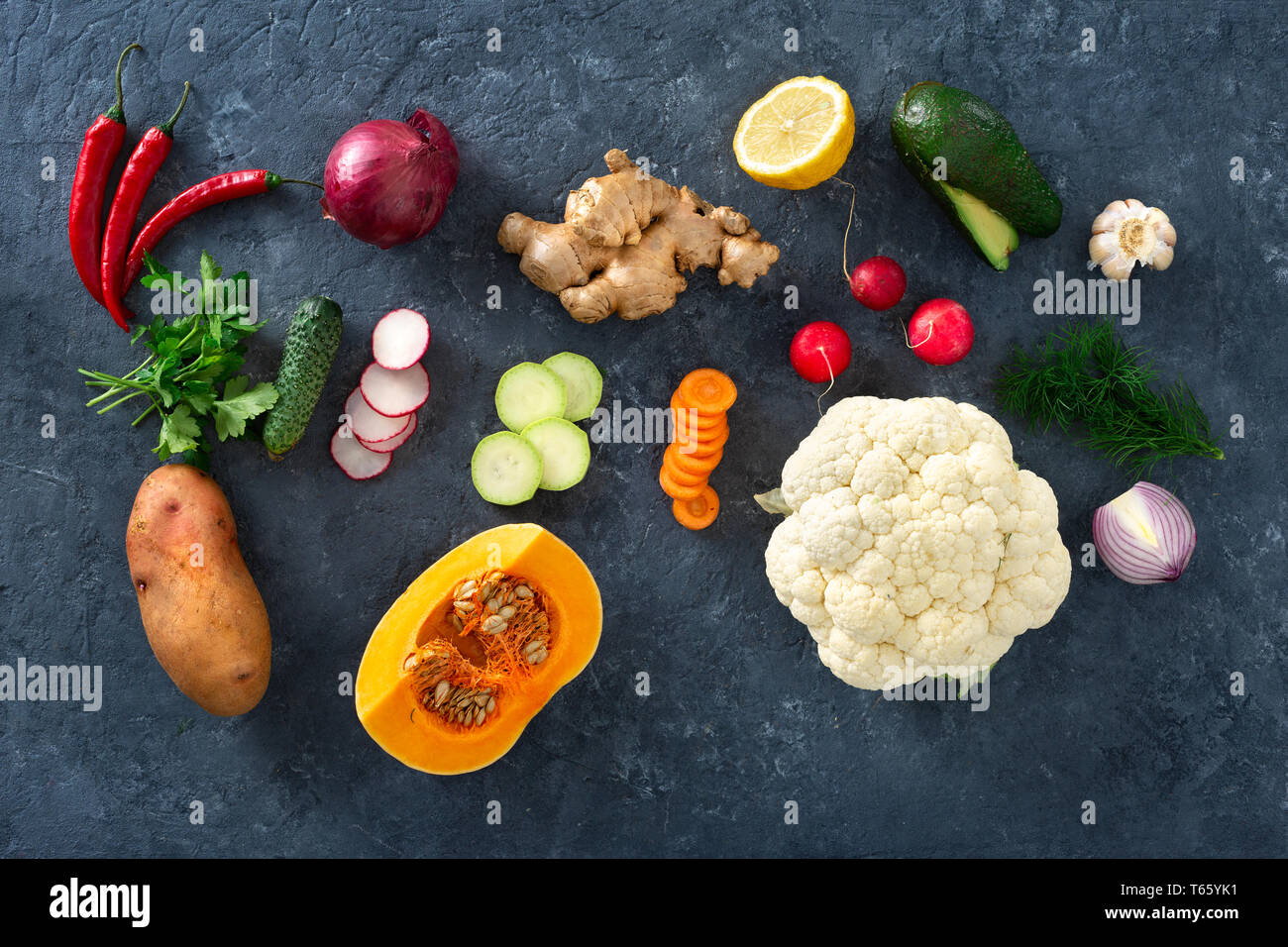 Set raw ingredients cooking vegetarian Indian food aloo gobi on dark ...