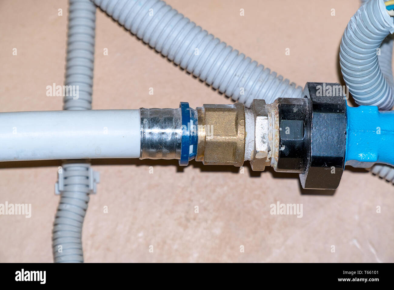 Connection of plastic pipes through the coupling. Plumbing water supply ...