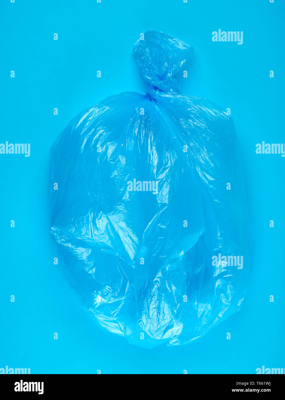 blue plastic bag for garbage on a blue background, top view Stock Photo ...