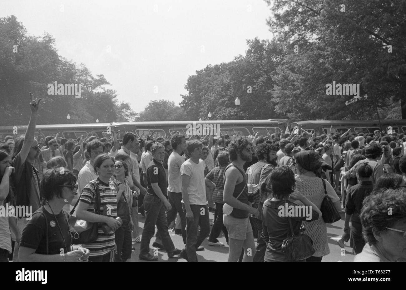 A crowd of protestors filling a street during the Kent State/Cambodia ...