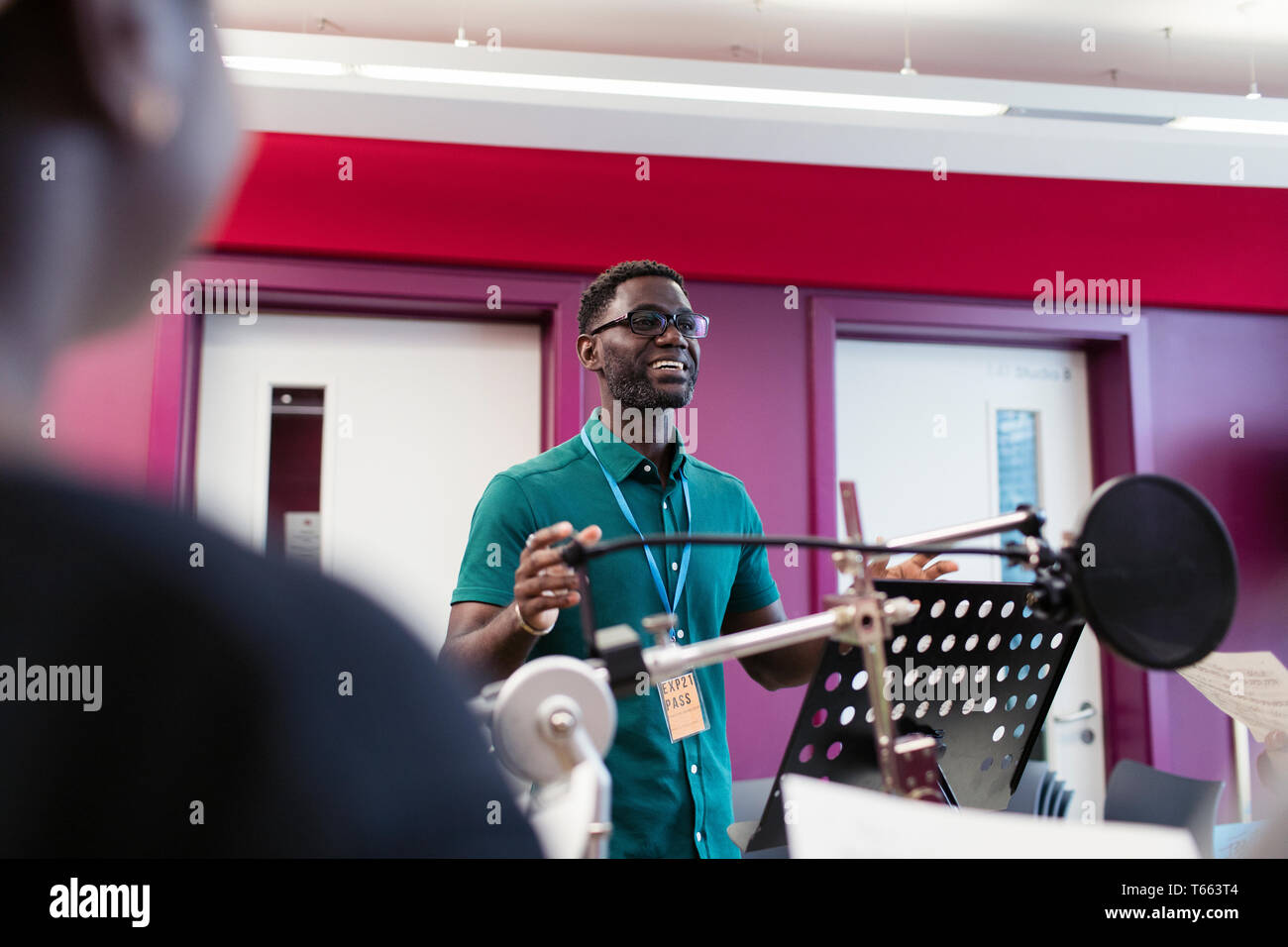 Confident male conductor in music recording studio Stock Photo - Alamy