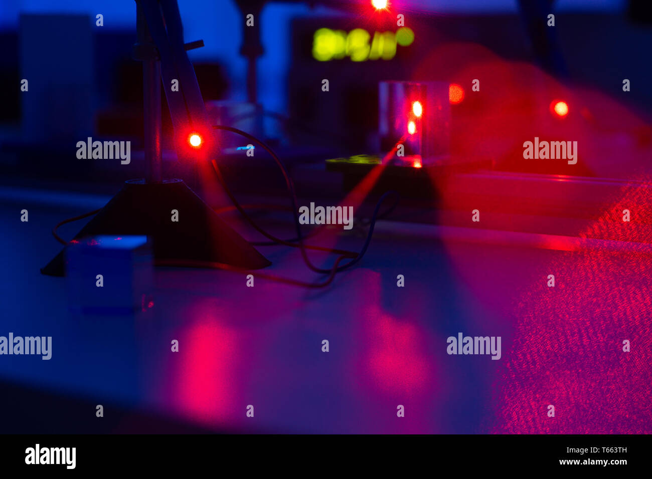 Experiment with a red laser in a physics lab Stock Photo - Alamy