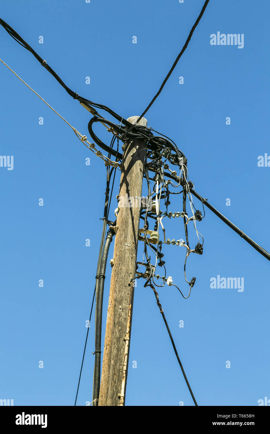 old wooden power line, isolated on blue sky Stock Photo - Alamy