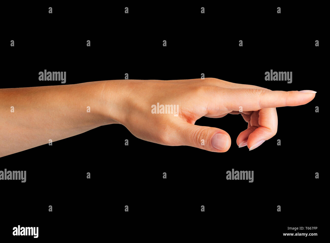 Woman hand with the index finger pointing on side on black background ...