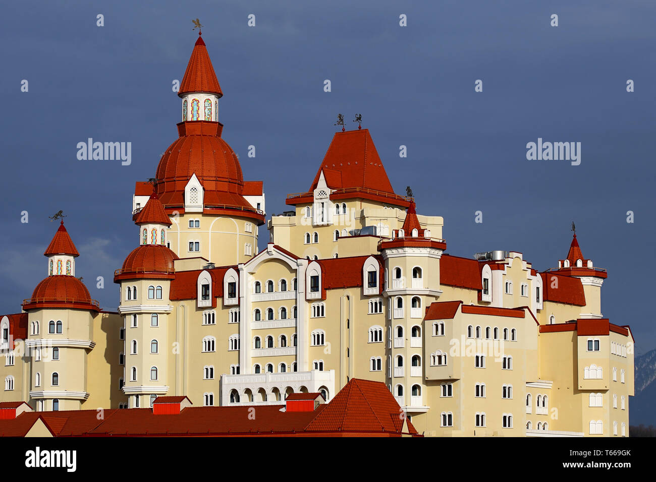 Building stylized under a fairytale castle with red towers Stock Photo ...