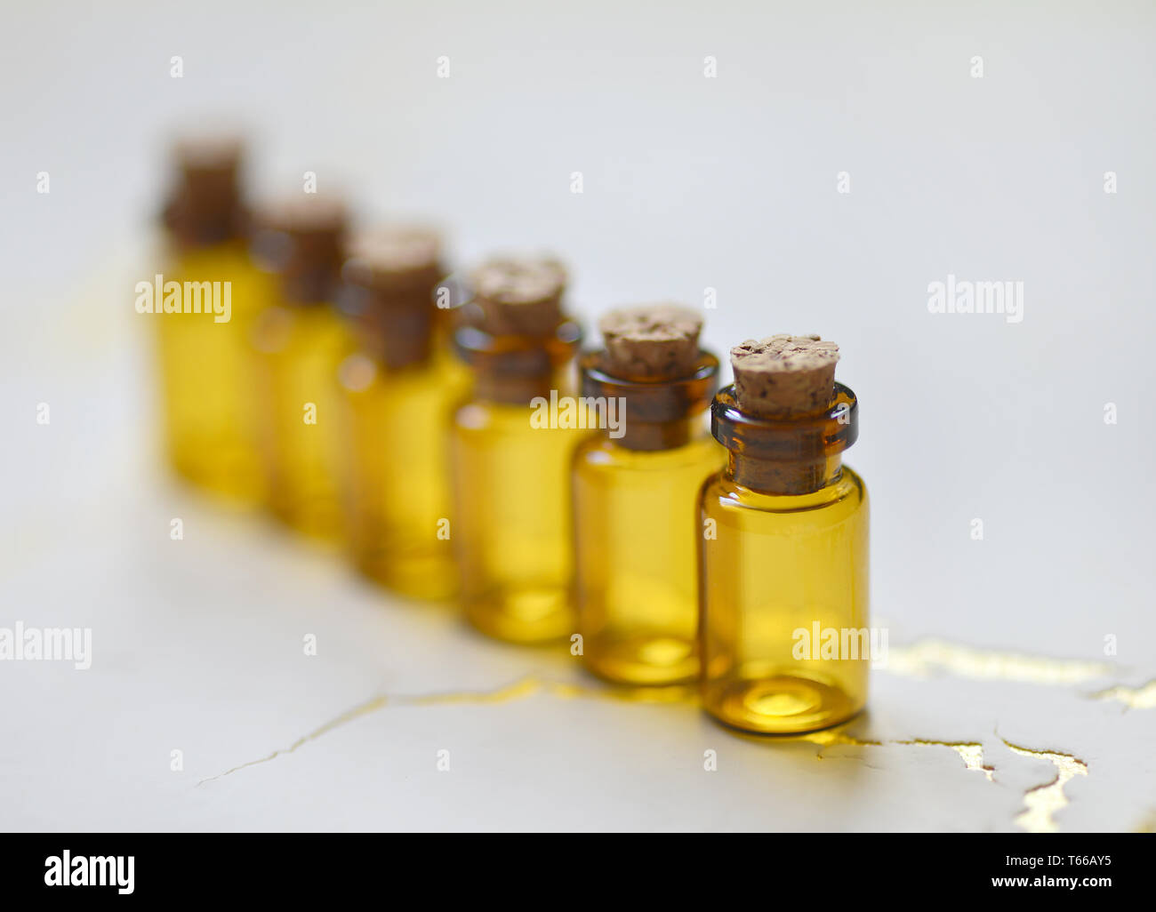 Small chemical glass bottles on white background Stock Photo - Alamy