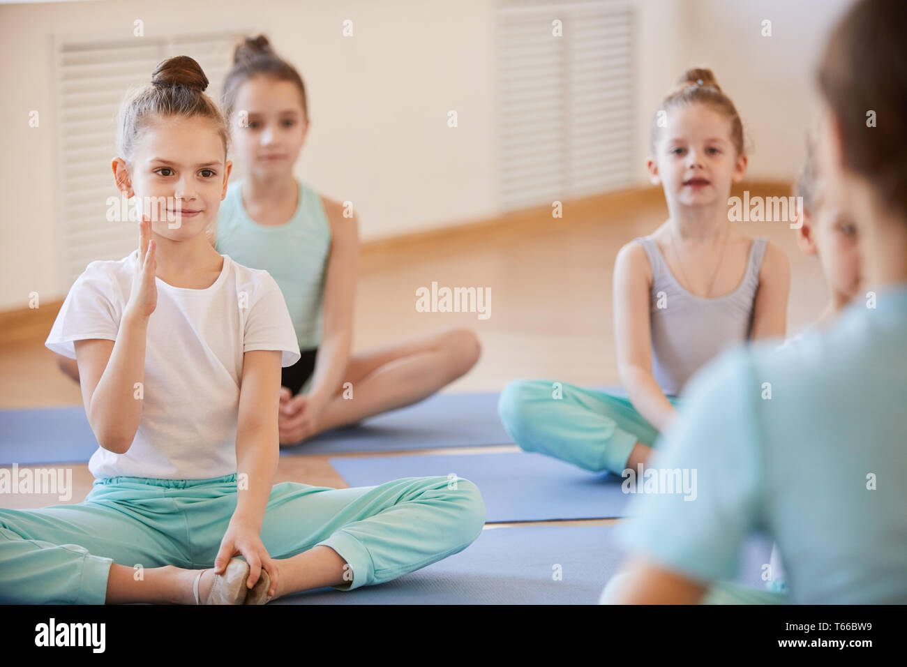 Girl Asking Question in Class Stock Photo - Alamy