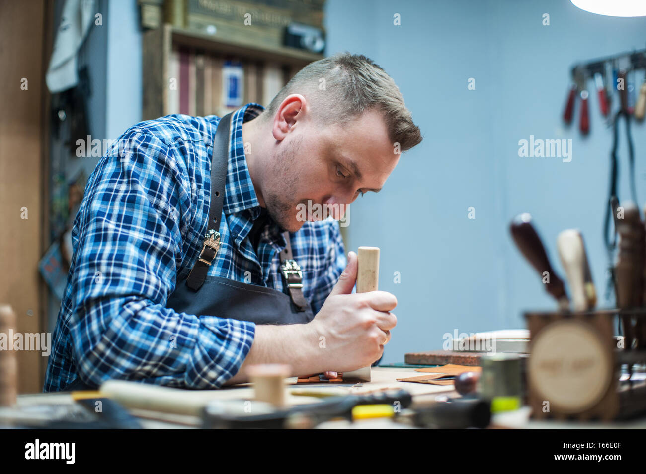 Concept of handmade craft production of leather goods Stock Photo - Alamy
