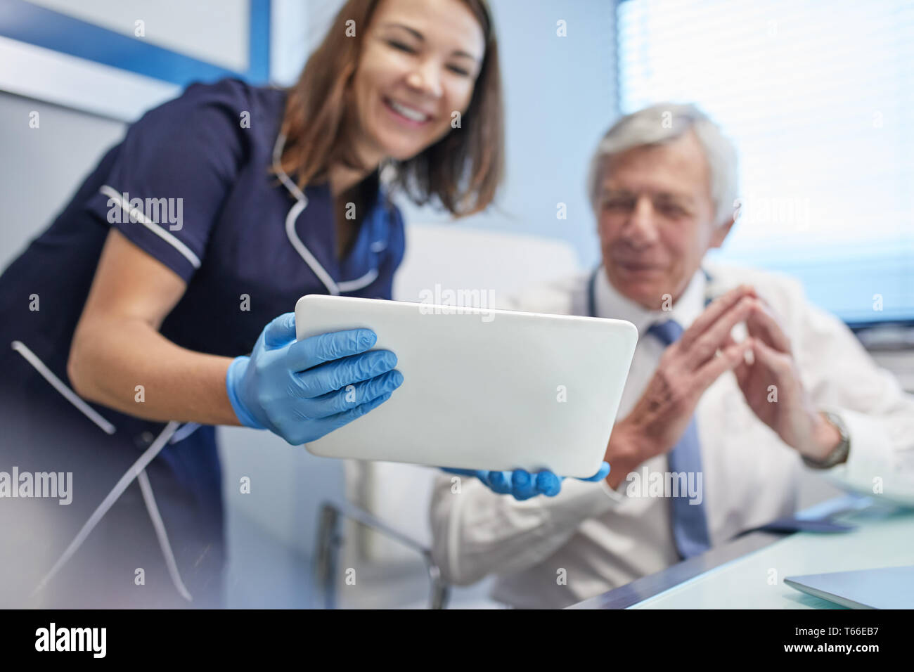 Nurse standing digital talking hi-res stock photography and images - Alamy
