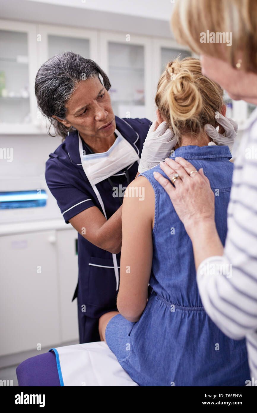 Doctor examining mature woman hi-res stock photography and images - Alamy