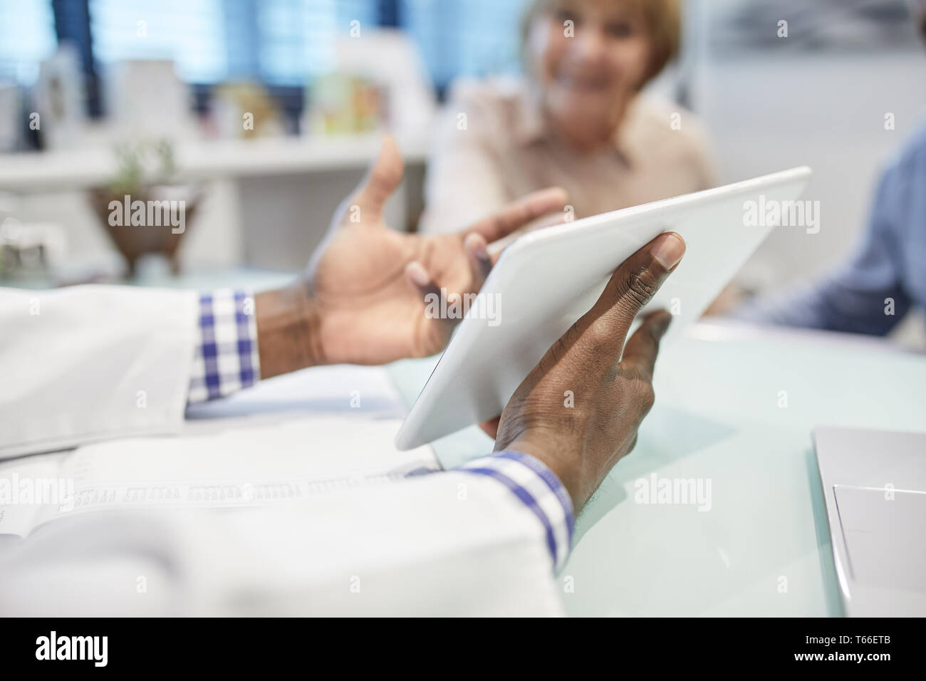 Woman talking using tablet computer hi-res stock photography and images ...