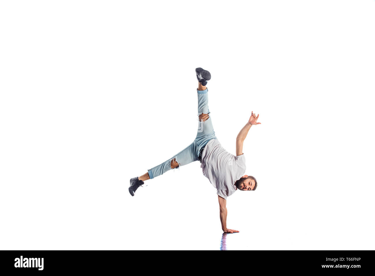 Cool guy doing brakdance on white background Stock Photo - Alamy