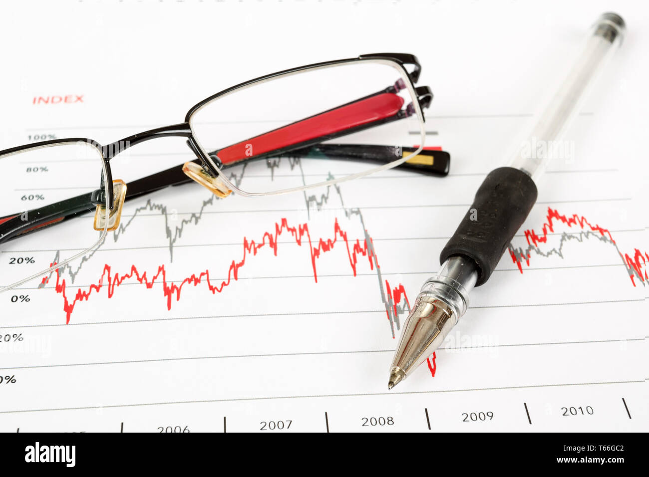 business graph with glasses in the background Stock Photo - Alamy