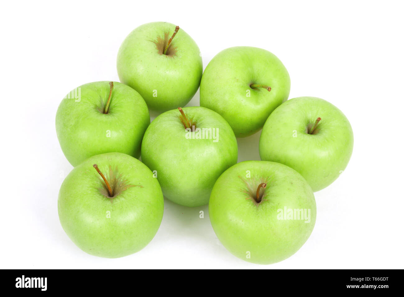 seven green apples isolated on a white background Stock Photo - Alamy