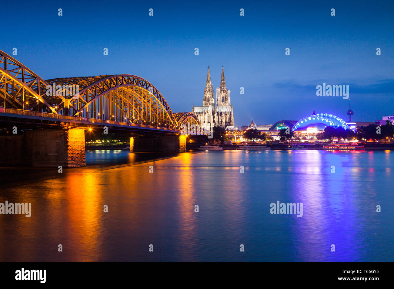 The Cologne Cathedral and the Hohenzollern railway bridge Stock Photo ...