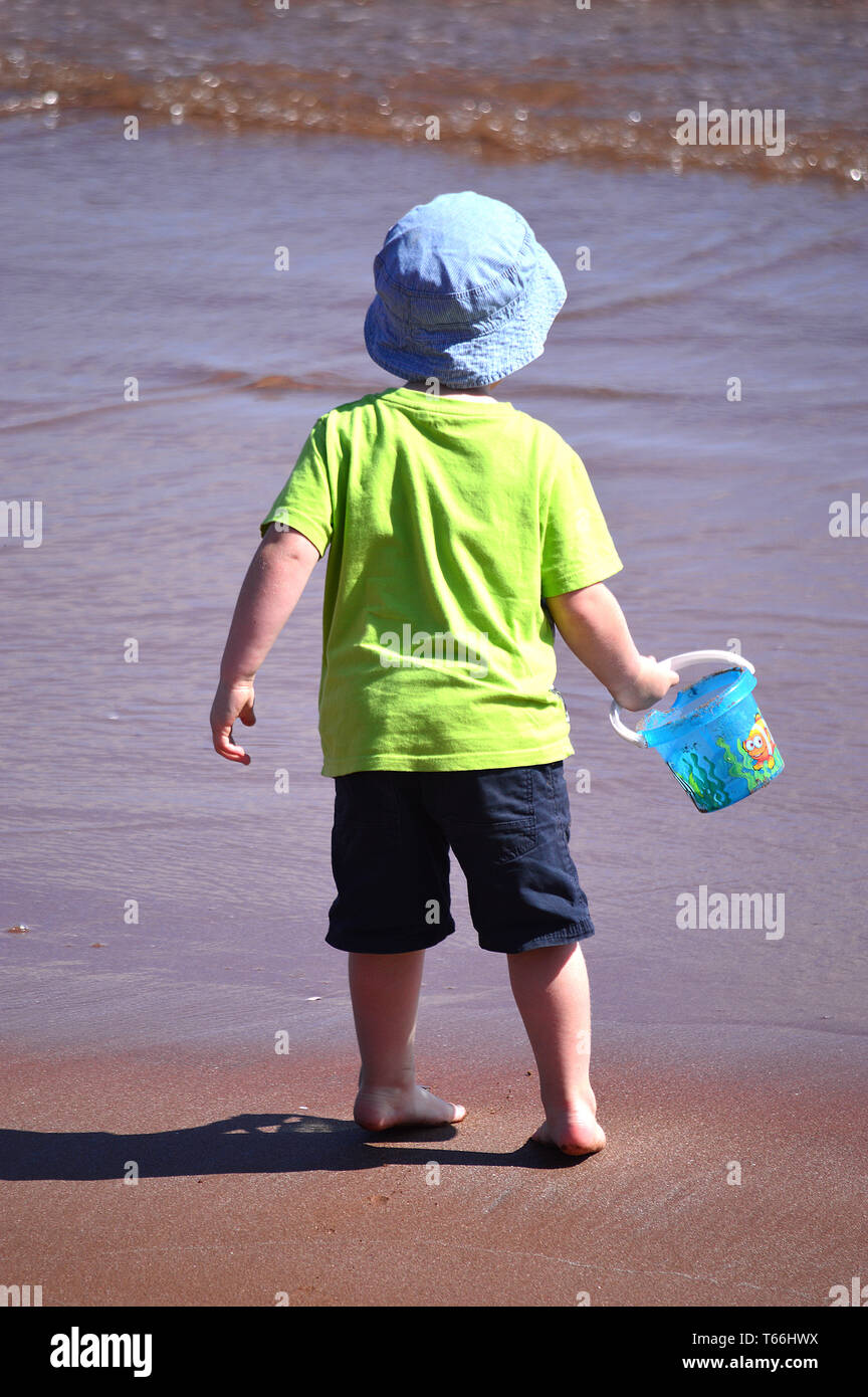 Boy building sandcastle on beach hi-res stock photography and images ...