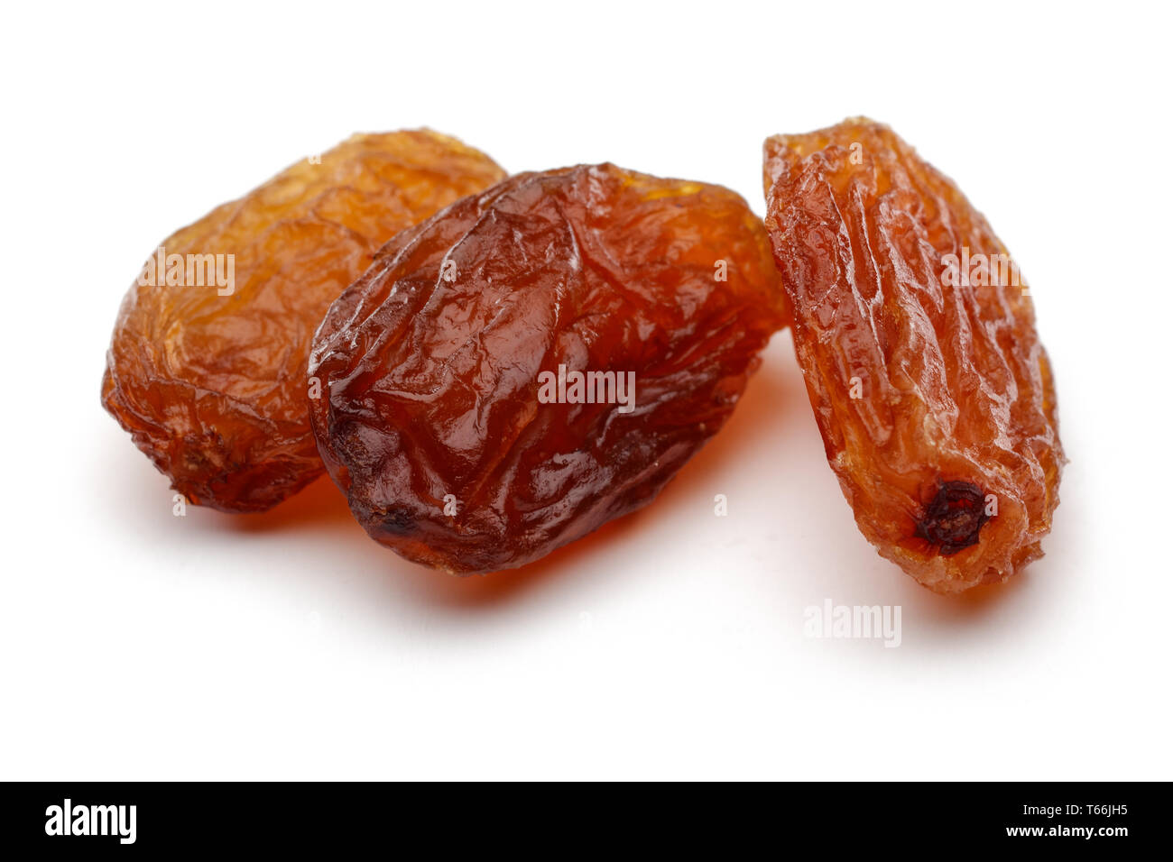 Golden raisin isolated on white background Stock Photo - Alamy