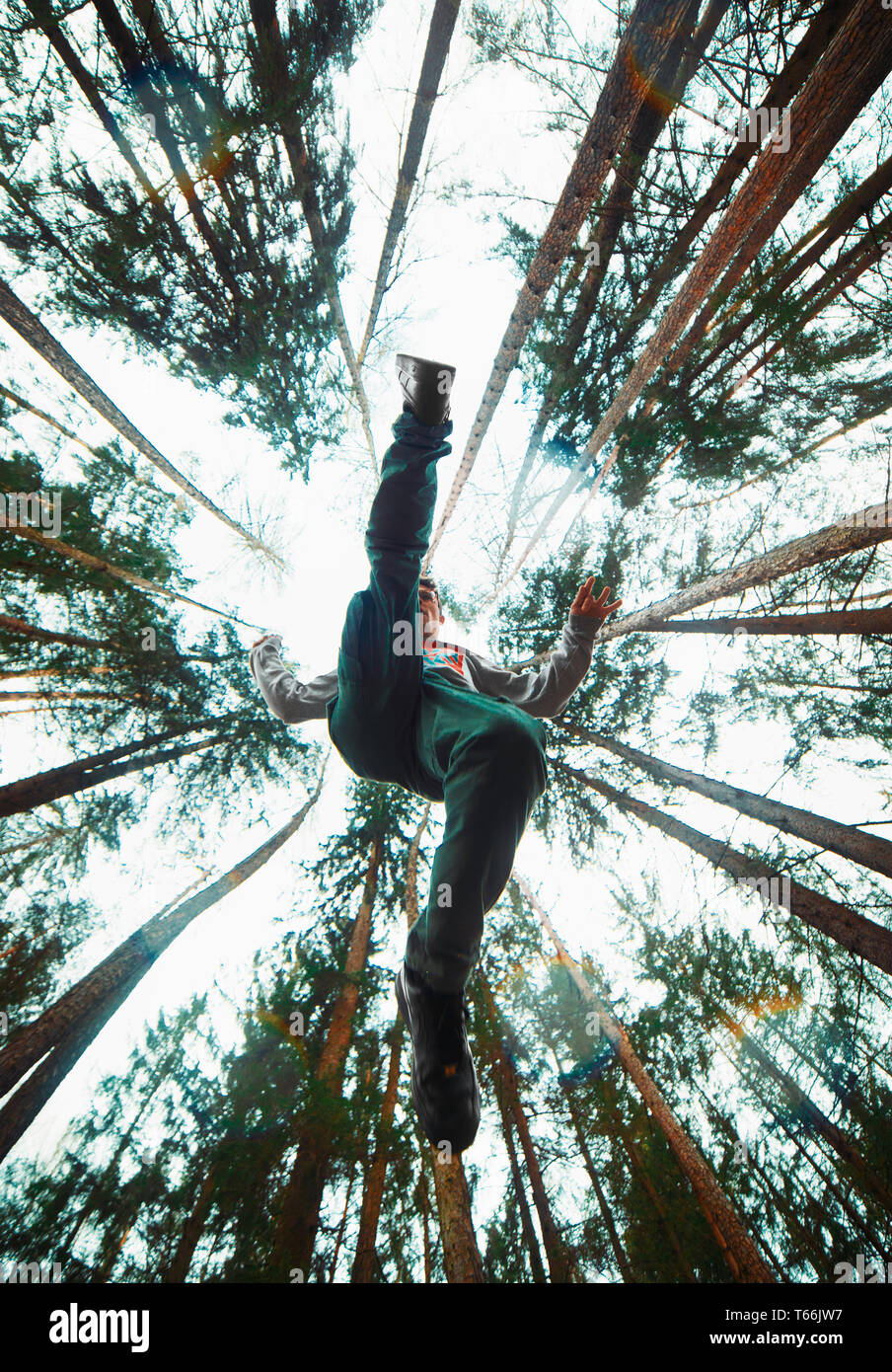 Boy jumps in the forest Stock Photo - Alamy