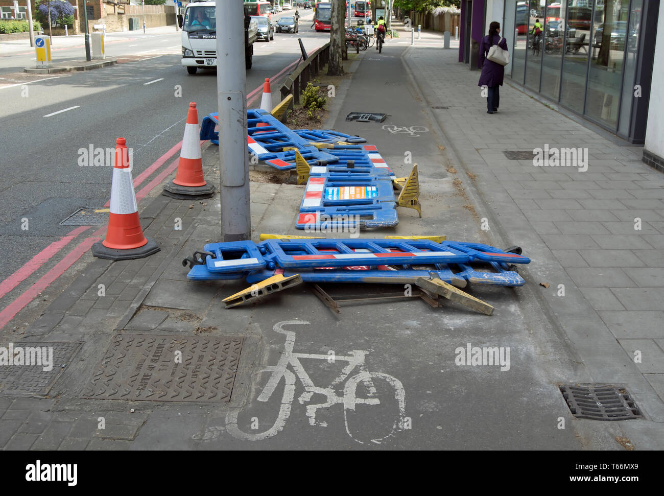having blown over in high winds, contractors' barriers block a marked ...