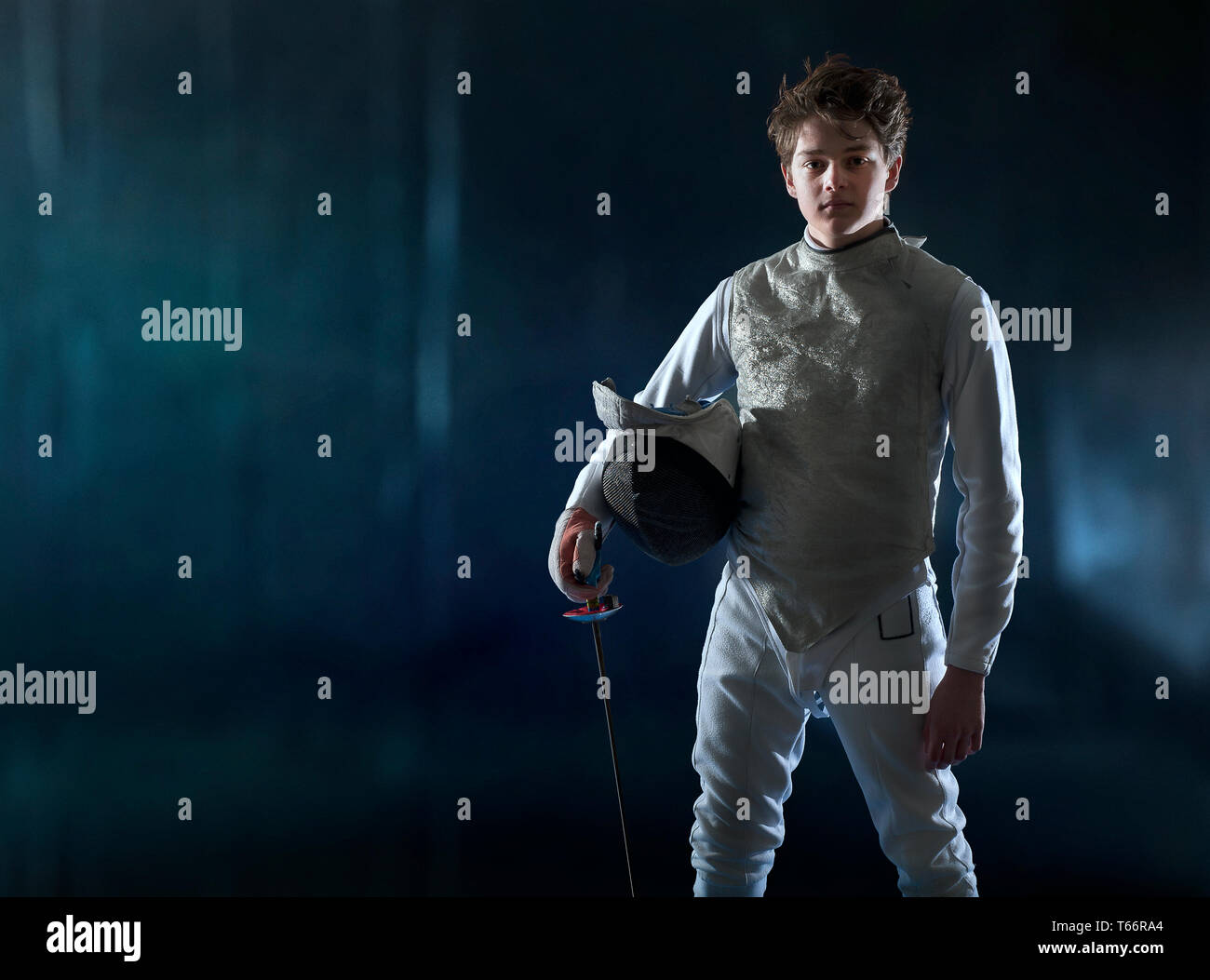 Portrait confident teenage boy fencing Stock Photo - Alamy Portrait confident teenage boy fencing Stock Photo - Alamy
