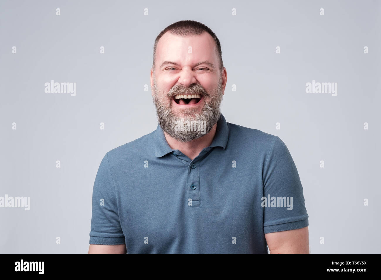 Caucasian mature man laughing on funny joke Stock Photo - Alamy