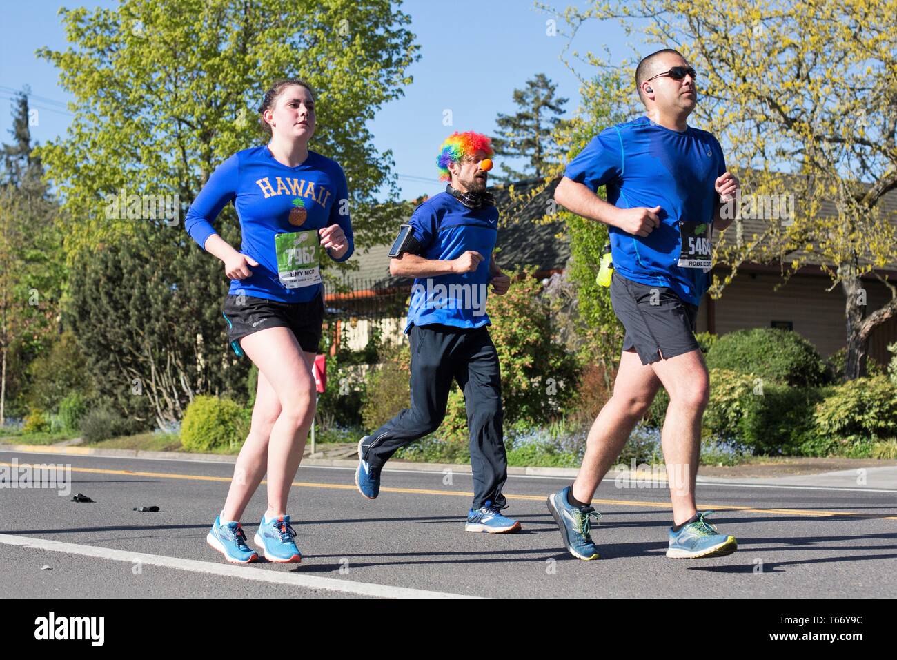 Participants, including a man dressed as a clown, running in the 2019 ...