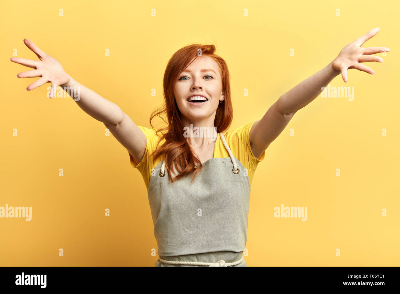 Beautiful excited happy woman open arms for hug looking at the camera ...