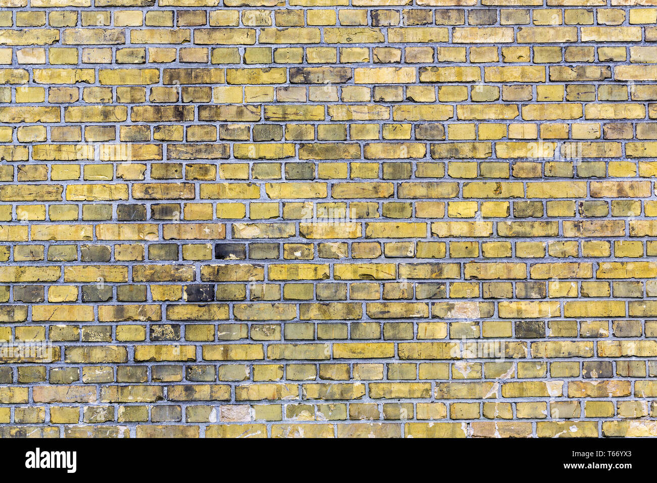 old yellow brick wall for backgrounds Stock Photo - Alamy