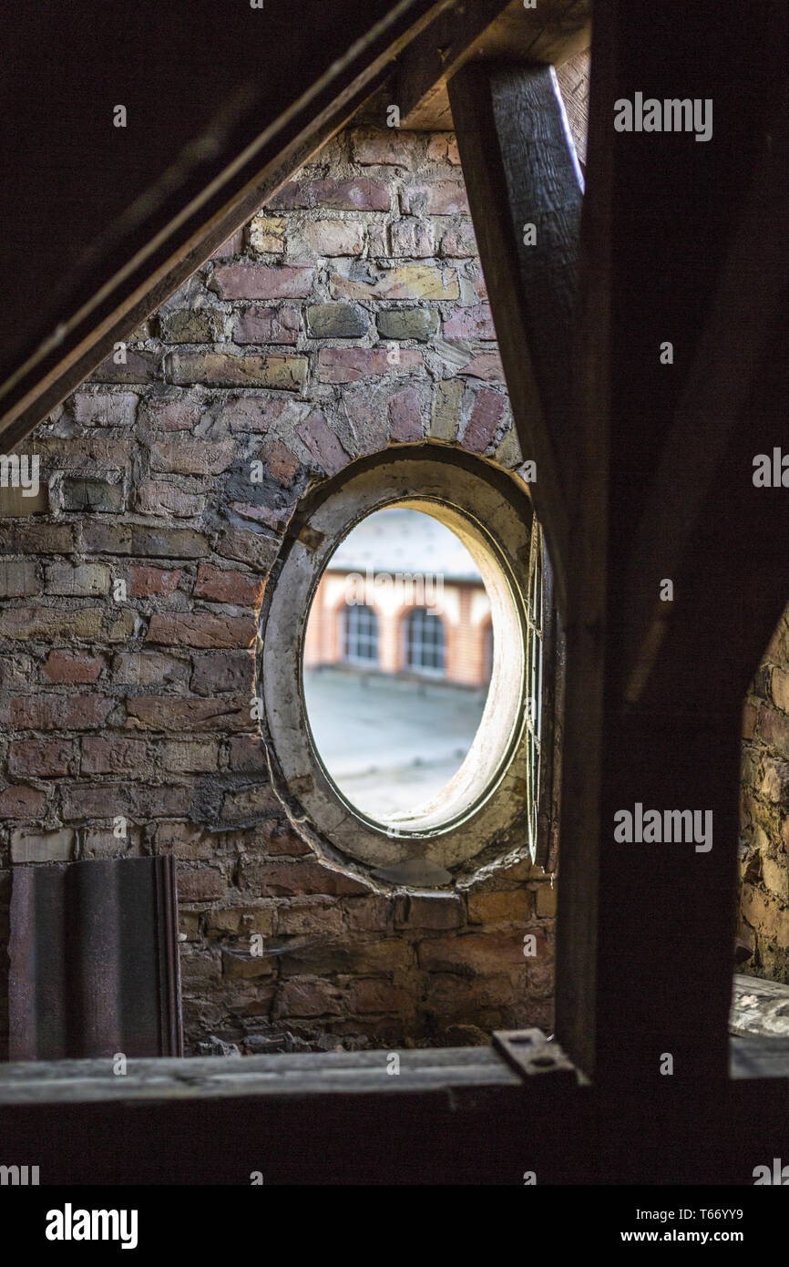 oval open window of a roof timbering Stock Photo - Alamy