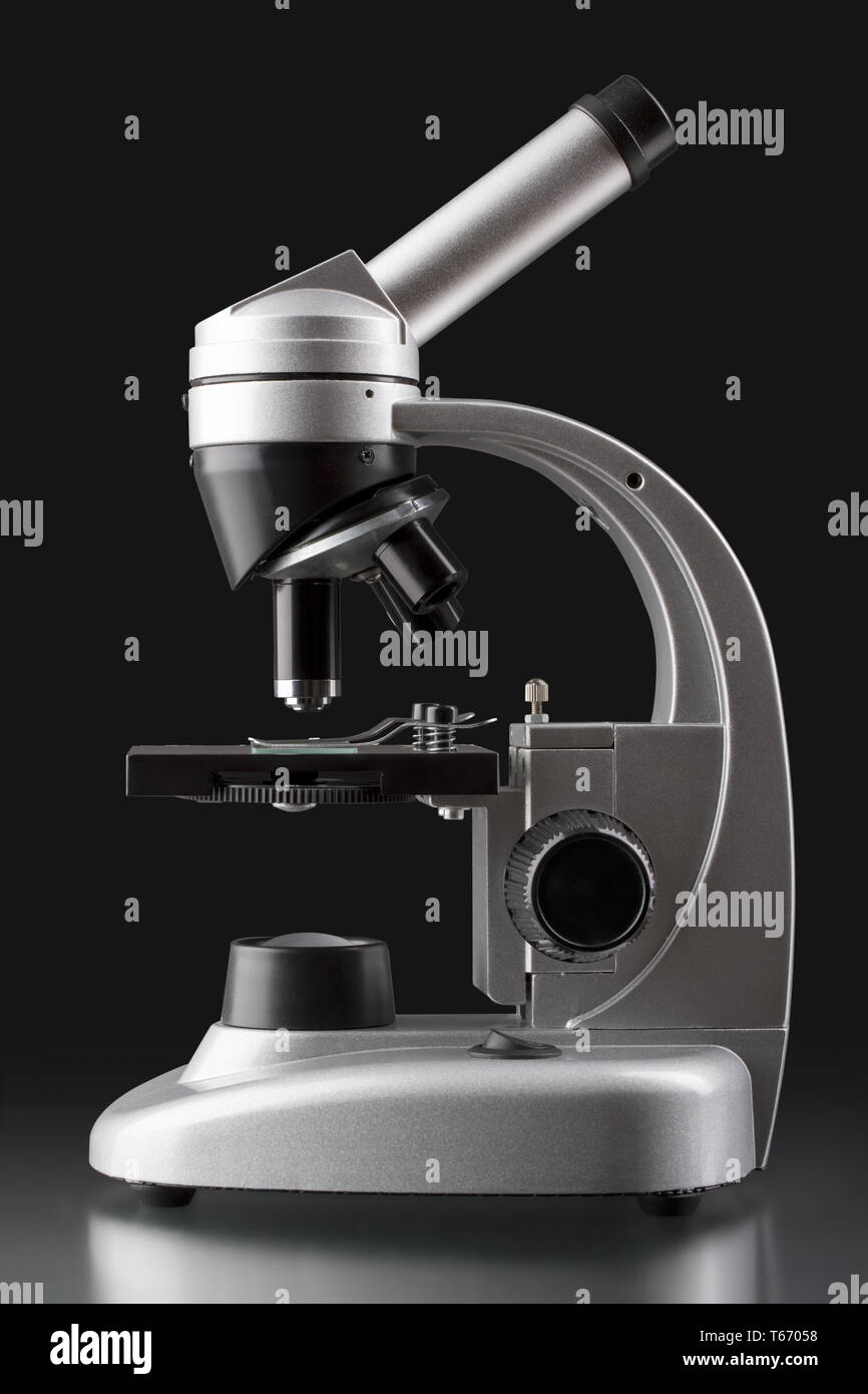 close up of a silver microscope, with black background Stock Photo - Alamy