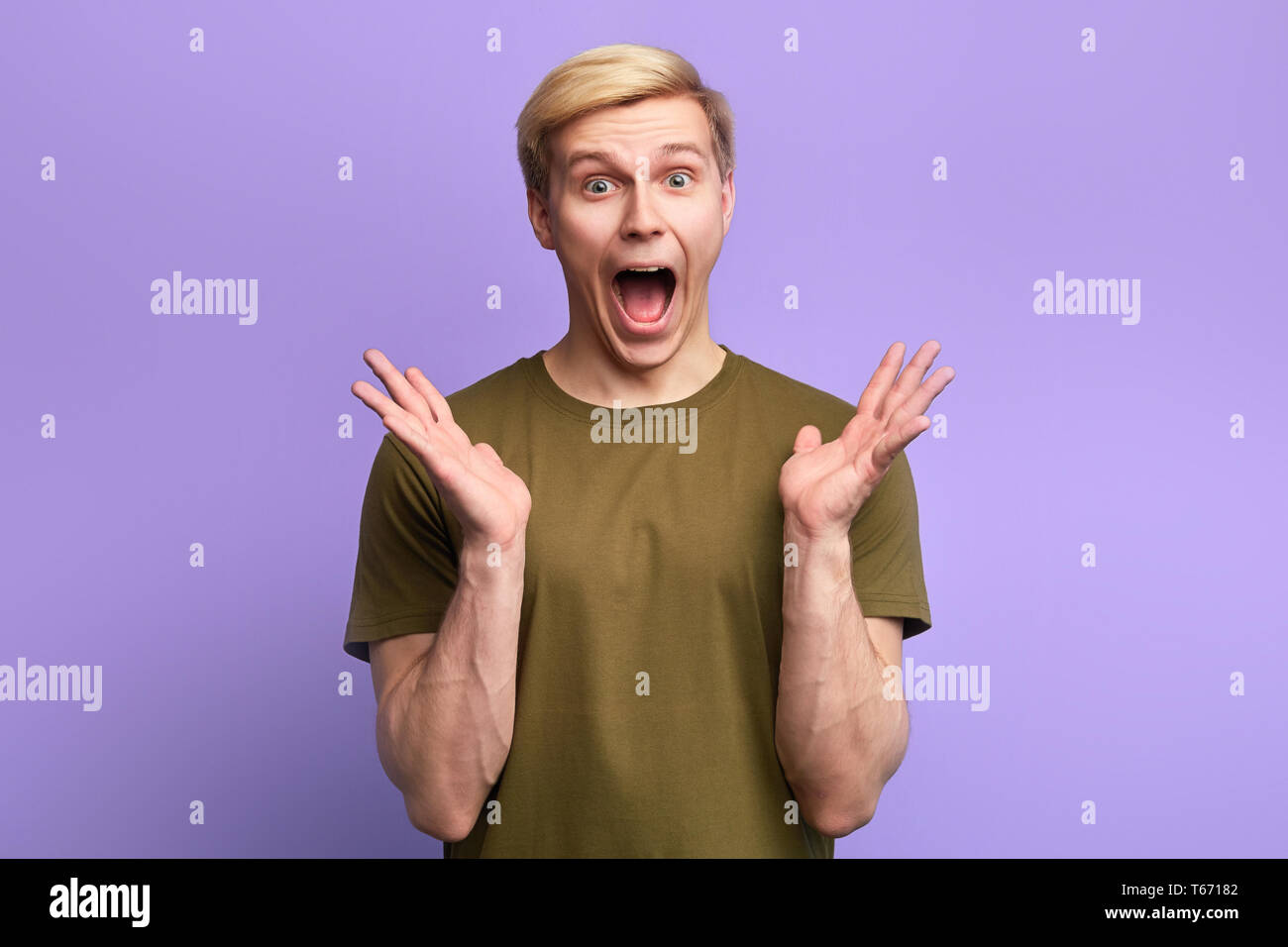 funny man with surprsied expression, being scared to hear horrified ...