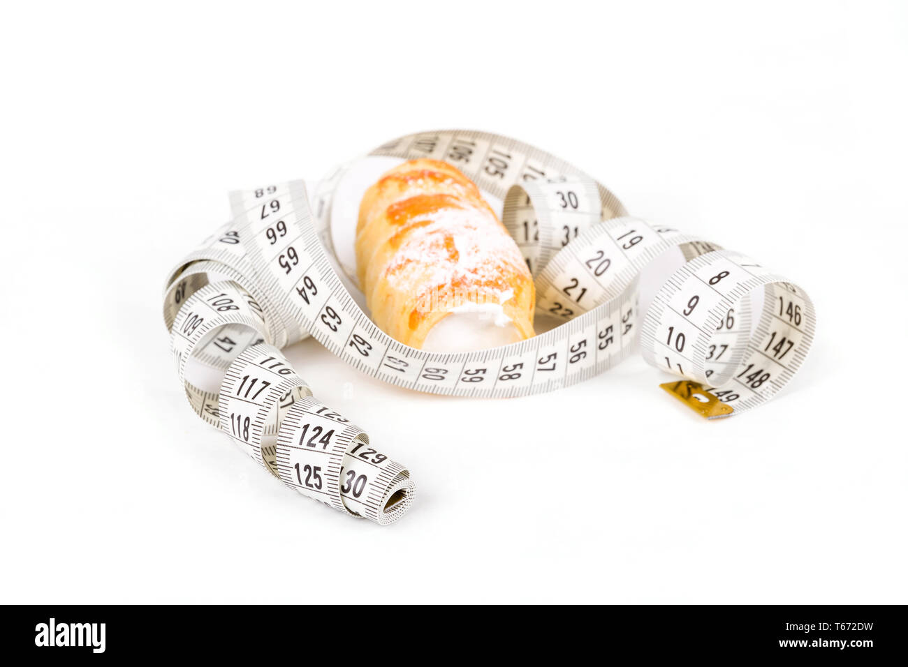 concept of slimming, cakes with measuring tape Stock Photo - Alamy