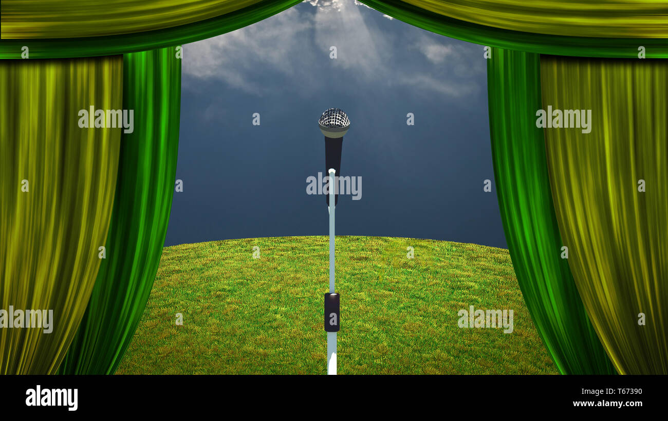 Microphone on green field stage Stock Photo - Alamy