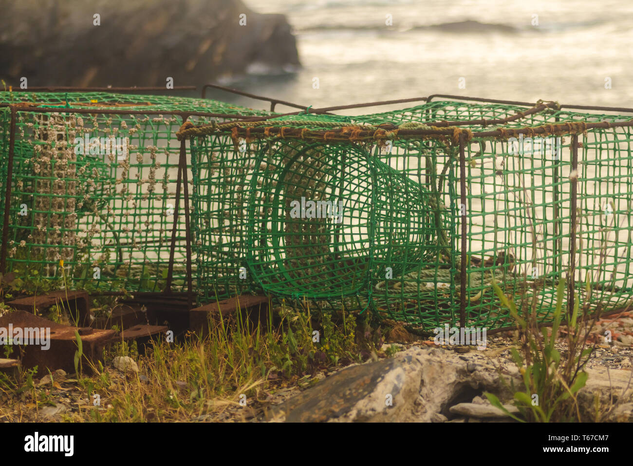 Old fishing cages on top of a rock, Porto das Barcas, Portugal Stock ...