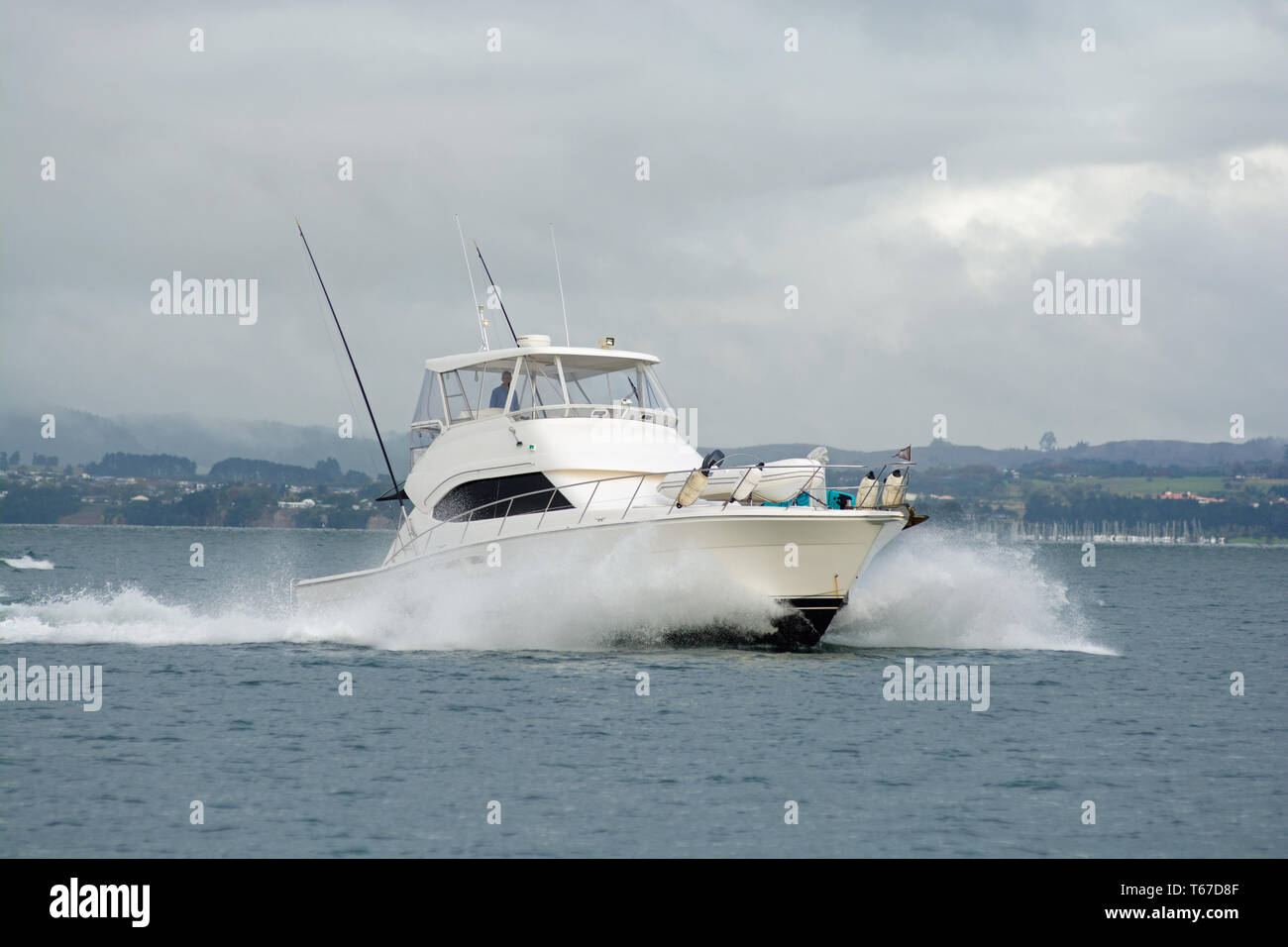 Riviera Launch "RUNAWAY" at Speed on the Hauraki Gulf NZ Stock Photo ...