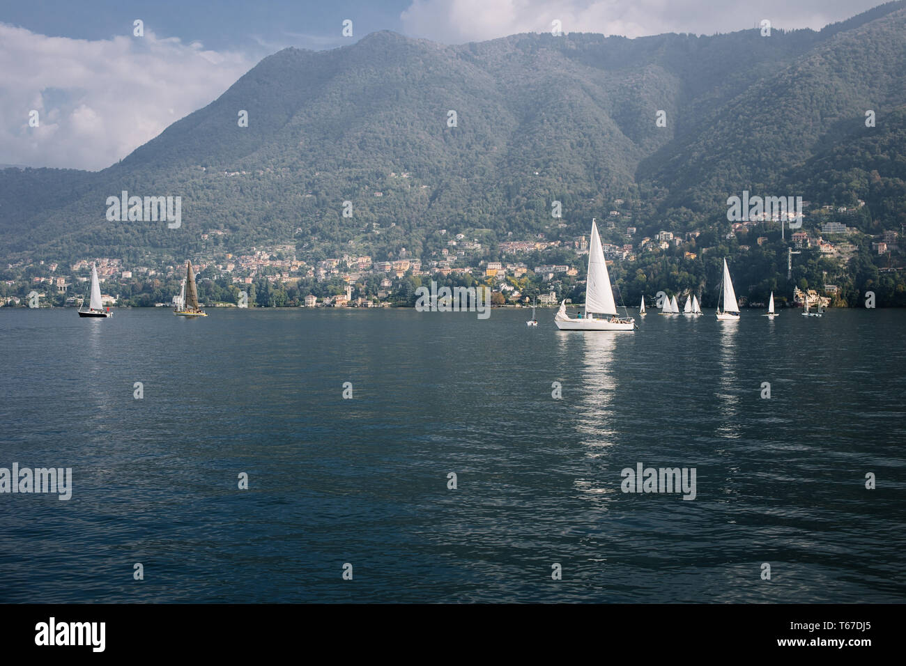 Small sailboat sailing in como lake hi-res stock photography and images ...