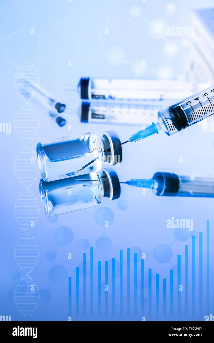 Drawing up of vaccine from ampule into syringe on color background ...